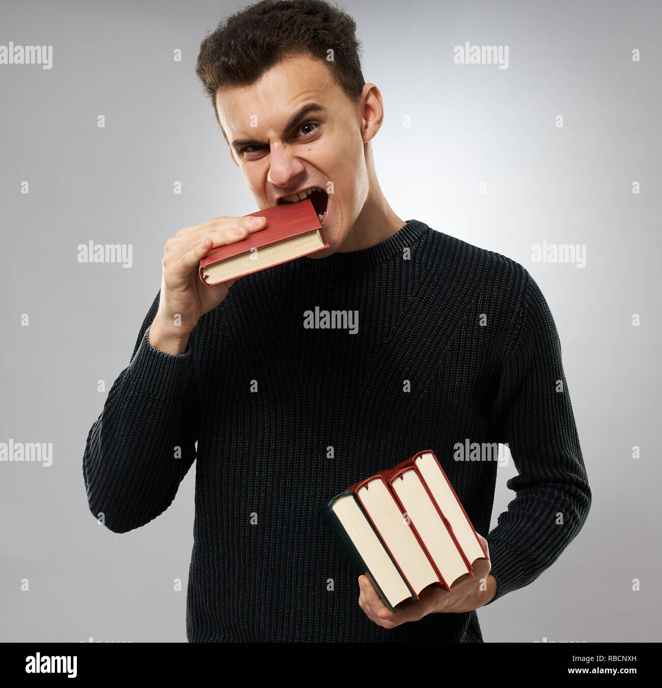 Stressed male teen with books hi-res stock photography and images - Alamy