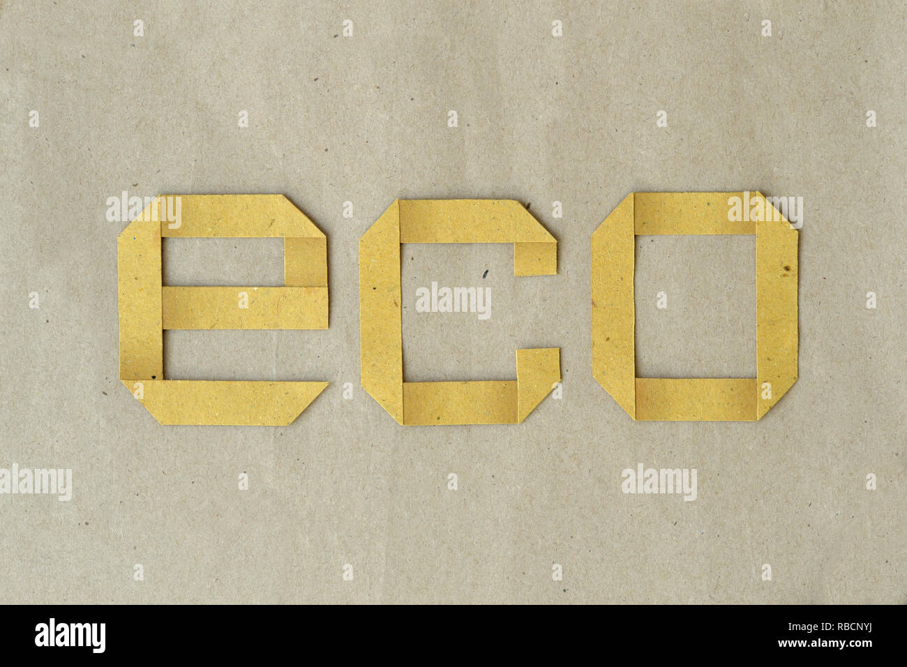 The word Eco written with recycled paper on recycled paper background ...
