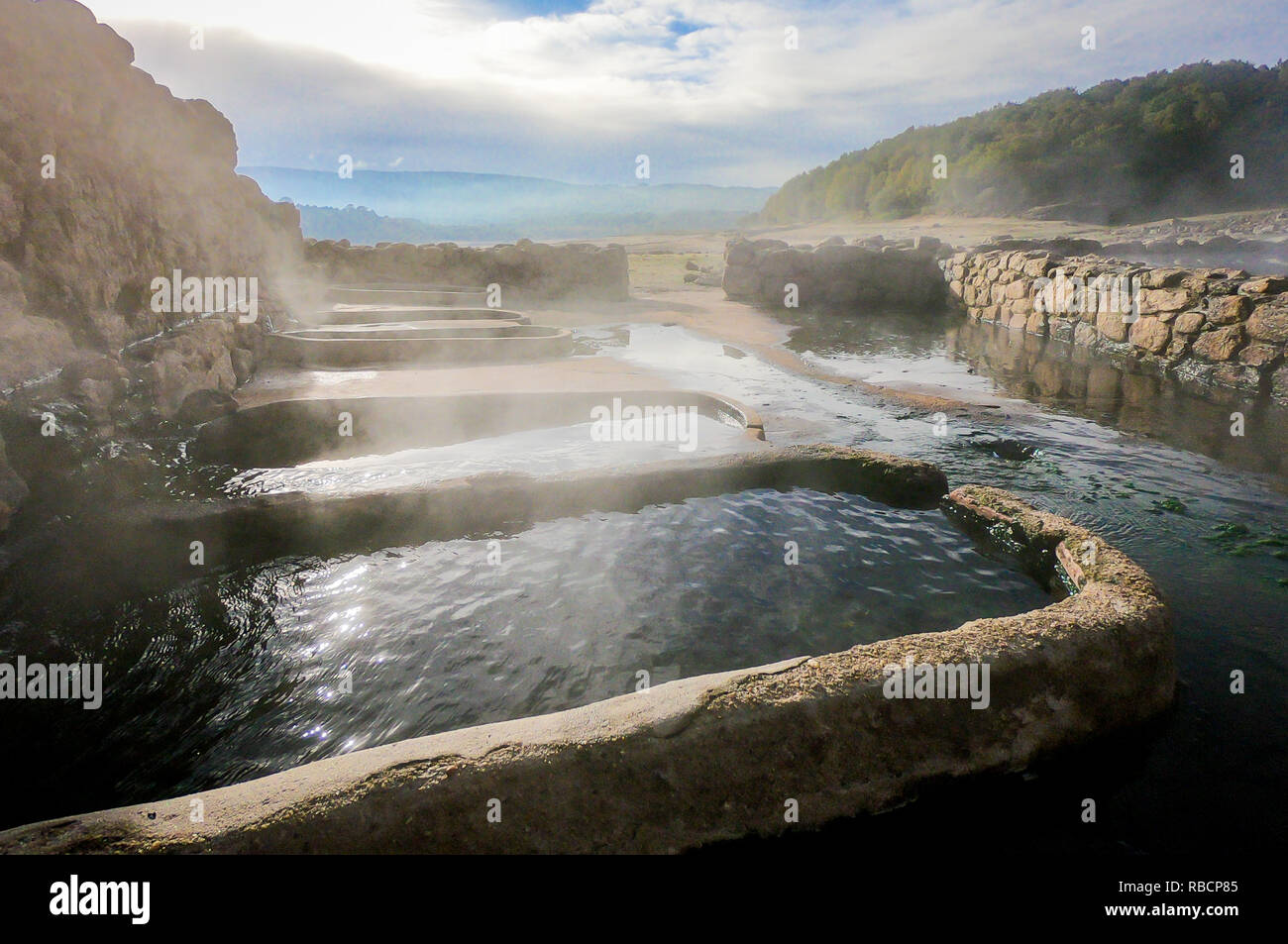 Natural Roman baths outdoors with hot steam and thermal water. Old ...