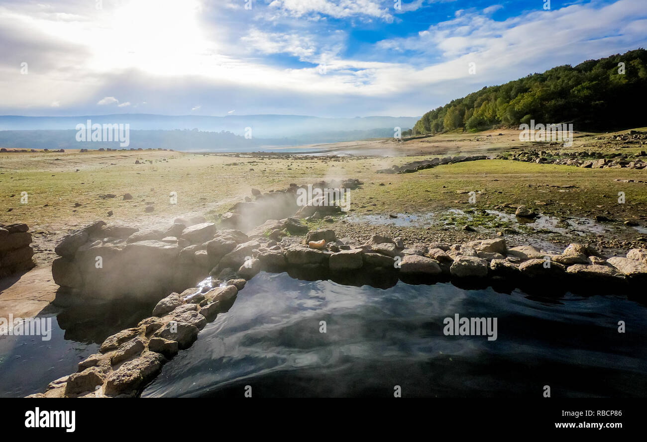Natural Roman baths outdoors with hot steam and thermal water. Old ...