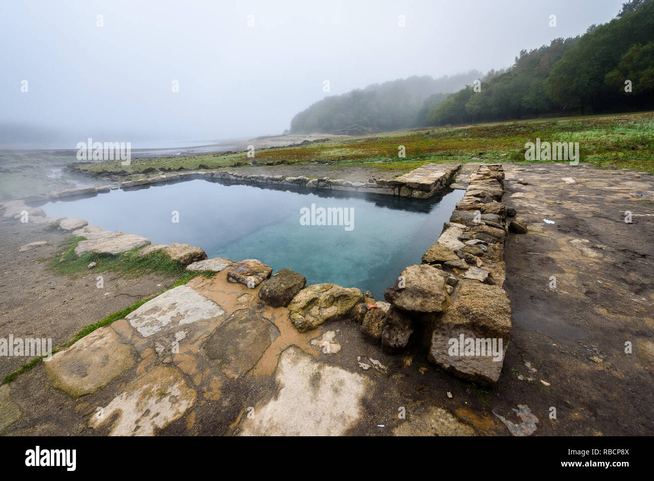 Natural Roman baths outdoors with hot steam and thermal water. Old ...