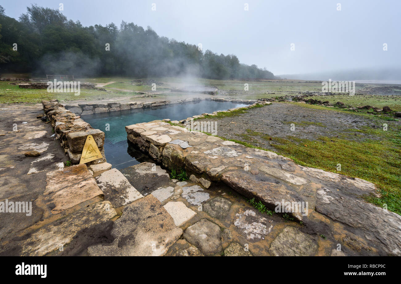 Natural Roman baths outdoors with hot steam and thermal water. Old ...