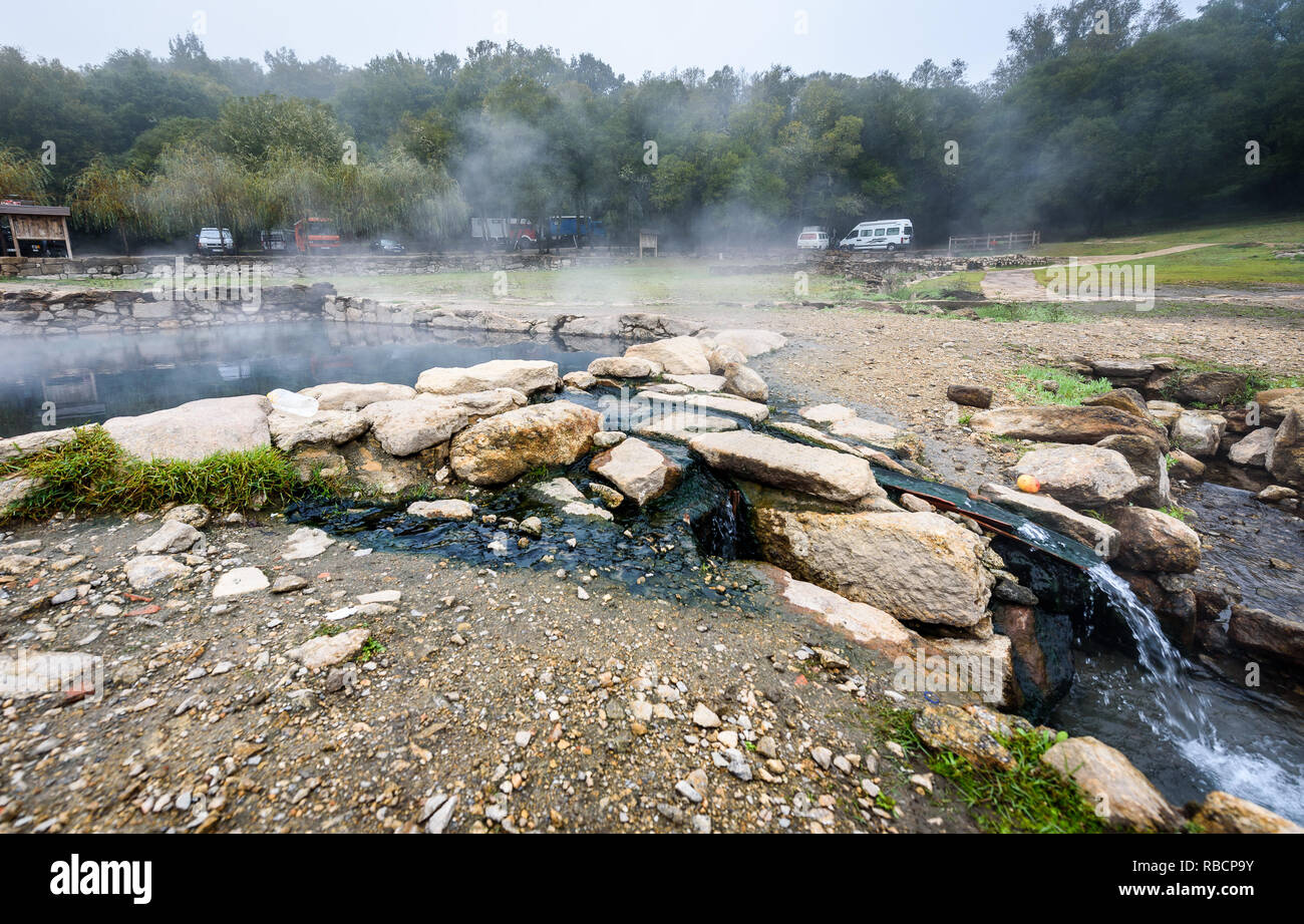 Natural Roman baths outdoors with hot steam and thermal water. Old ...