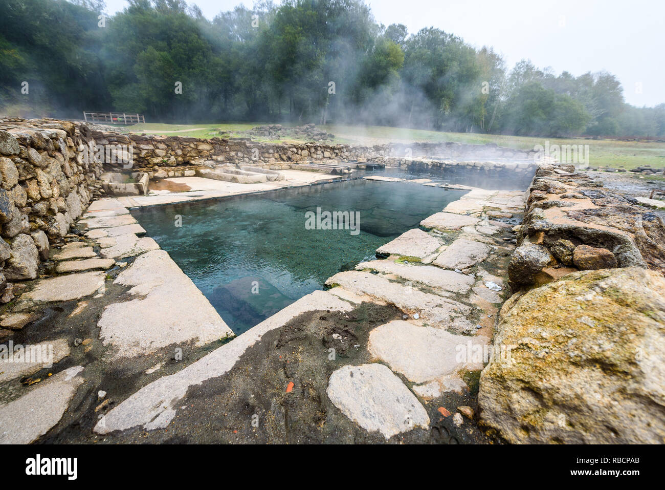 Natural Roman baths outdoors with hot steam and thermal water. Old ...