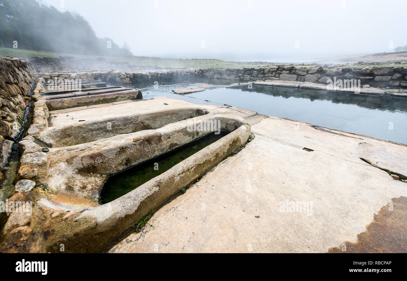 Natural Roman baths outdoors with hot steam and thermal water. Old ...