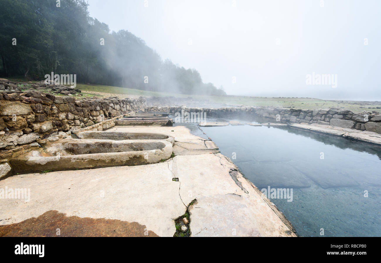 Natural Roman baths outdoors with hot steam and thermal water. Old ...