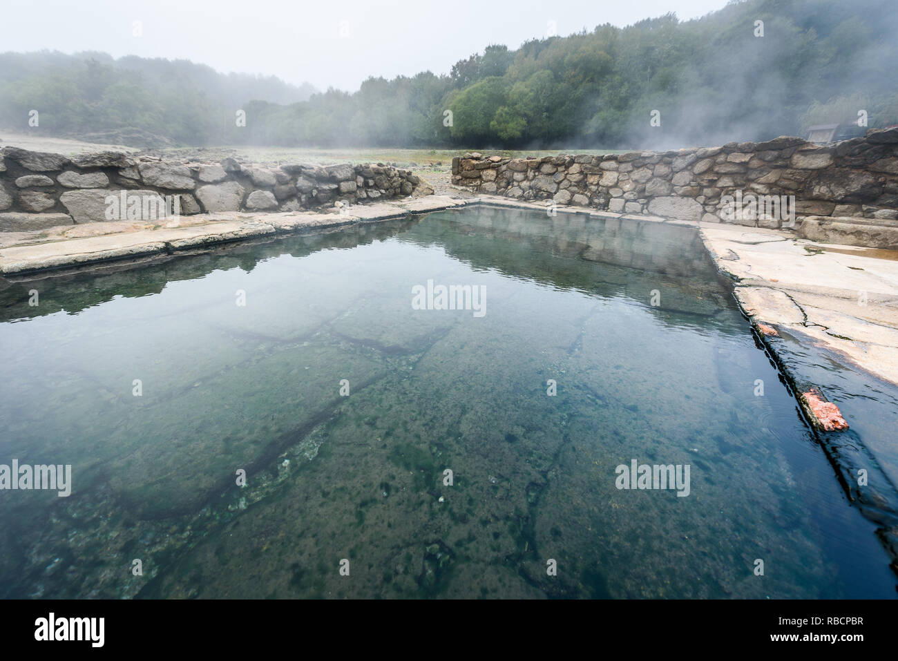 Natural Roman baths outdoors with hot steam and thermal water. Old ...