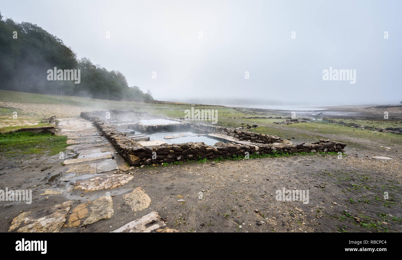 Natural Roman baths outdoors with hot steam and thermal water. Old ...