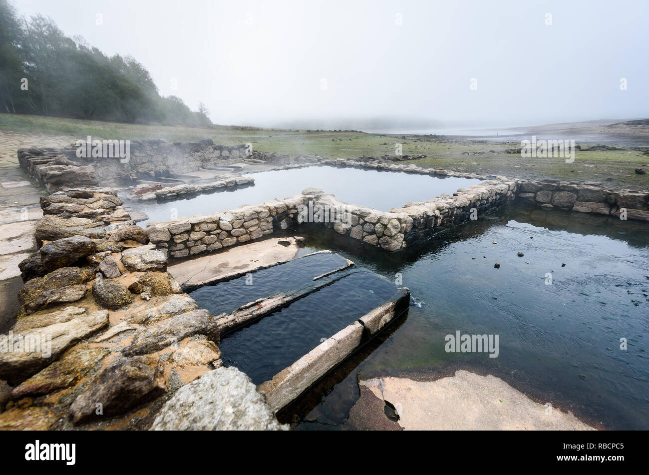 Natural Roman baths outdoors with hot steam and thermal water. Old ...