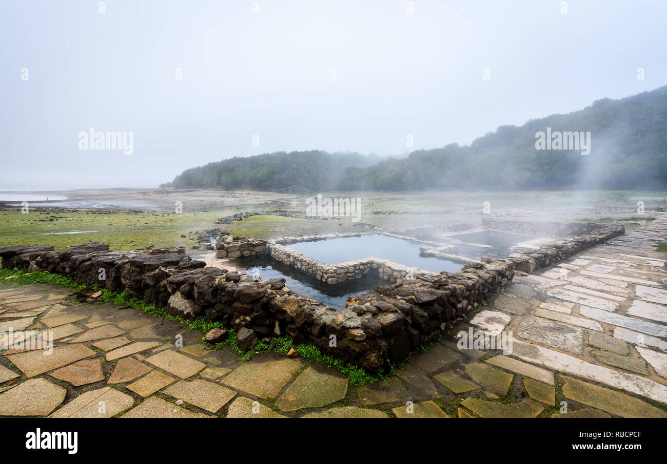 Natural Roman baths outdoors with hot steam and thermal water. Old ...