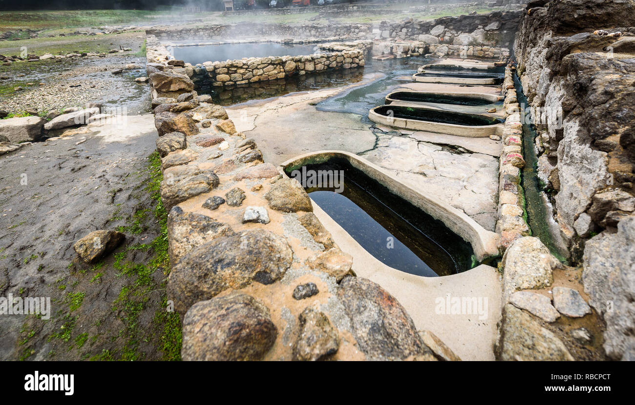 Natural Roman baths outdoors with hot steam and thermal water. Old ...