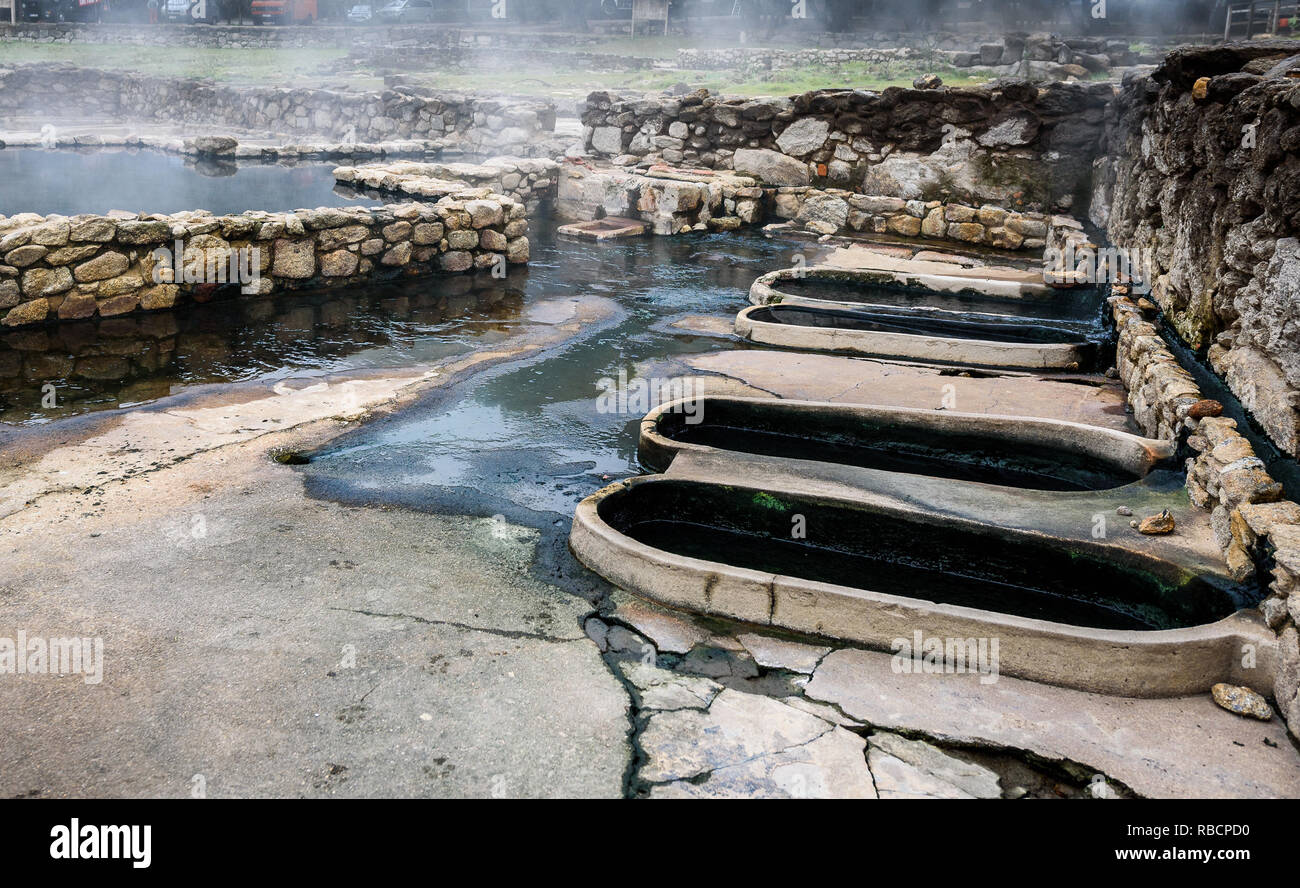 Natural Roman baths outdoors with hot steam and thermal water. Old ...