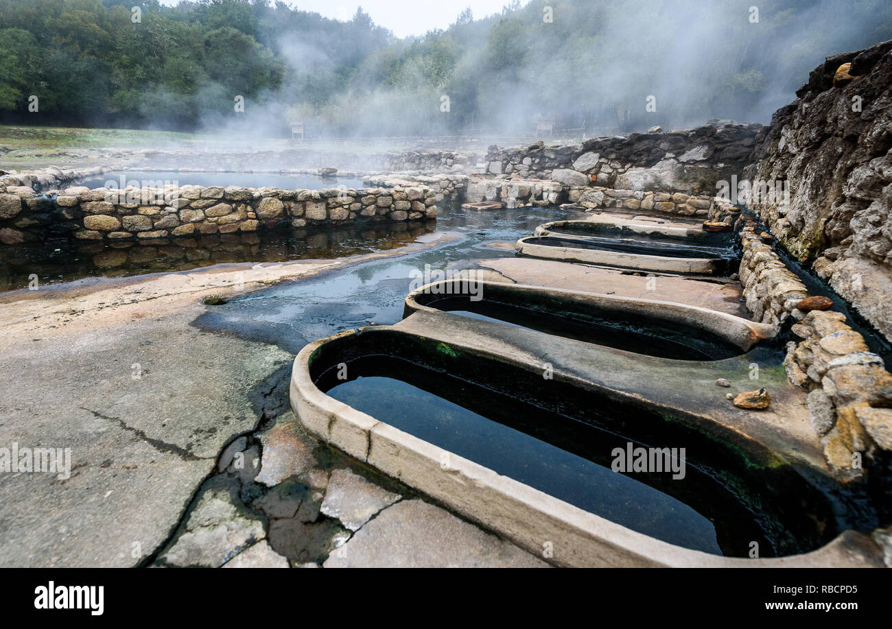 Natural Roman baths outdoors with hot steam and thermal water. Old ...