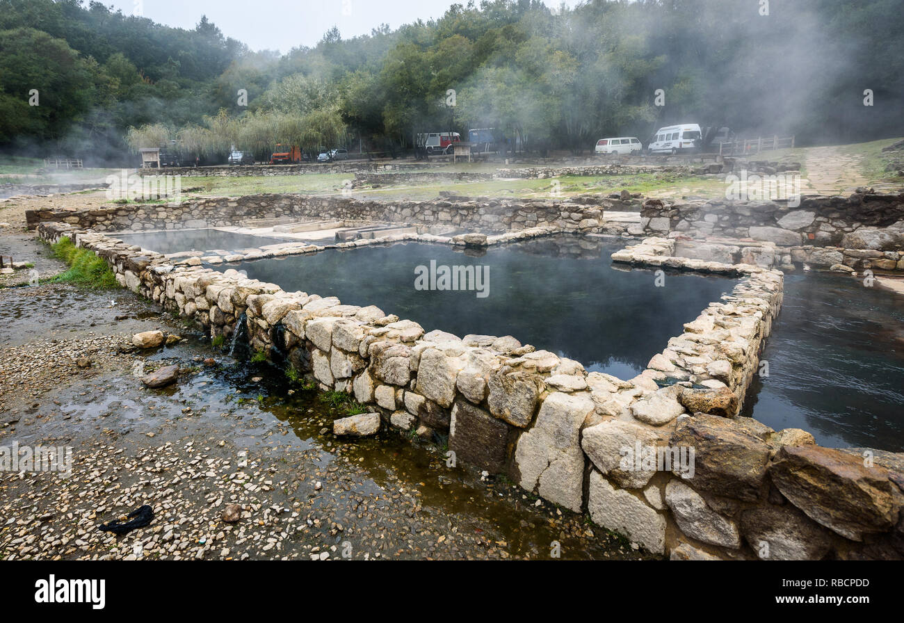 Natural Roman baths outdoors with hot steam and thermal water. Old ...