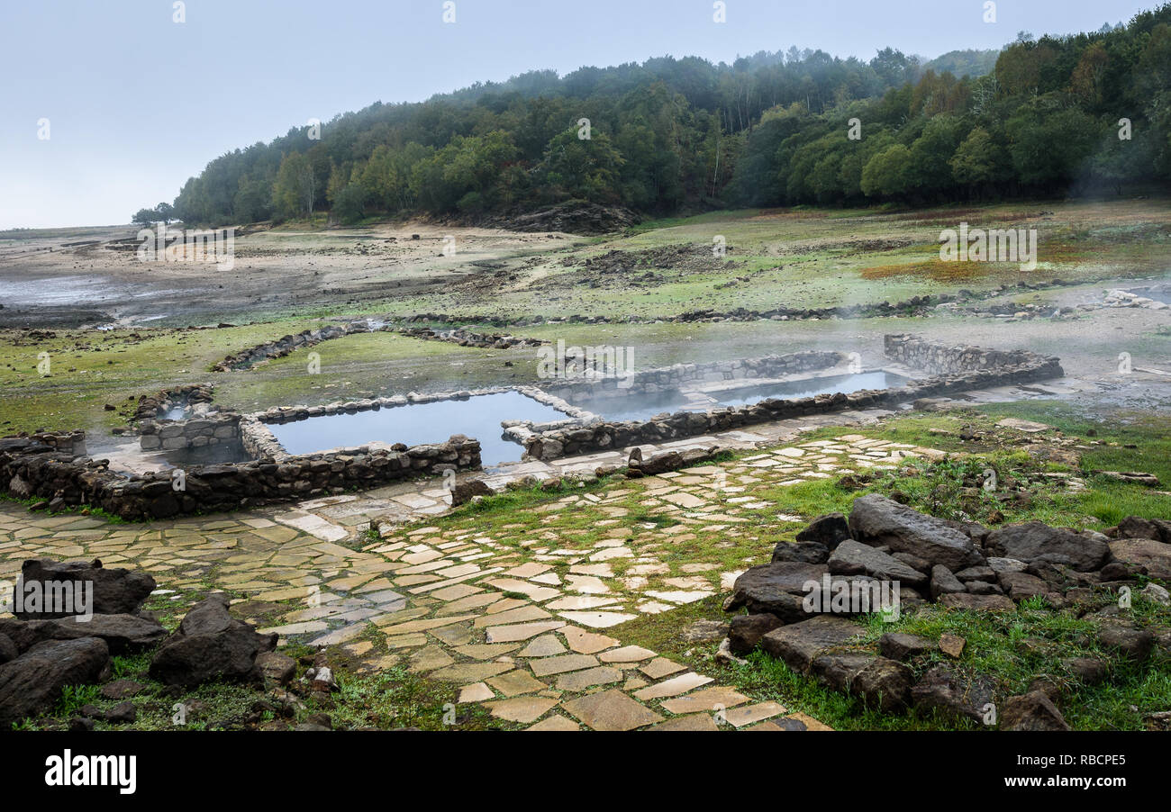 Natural Roman baths outdoors with hot steam and thermal water. Old ...