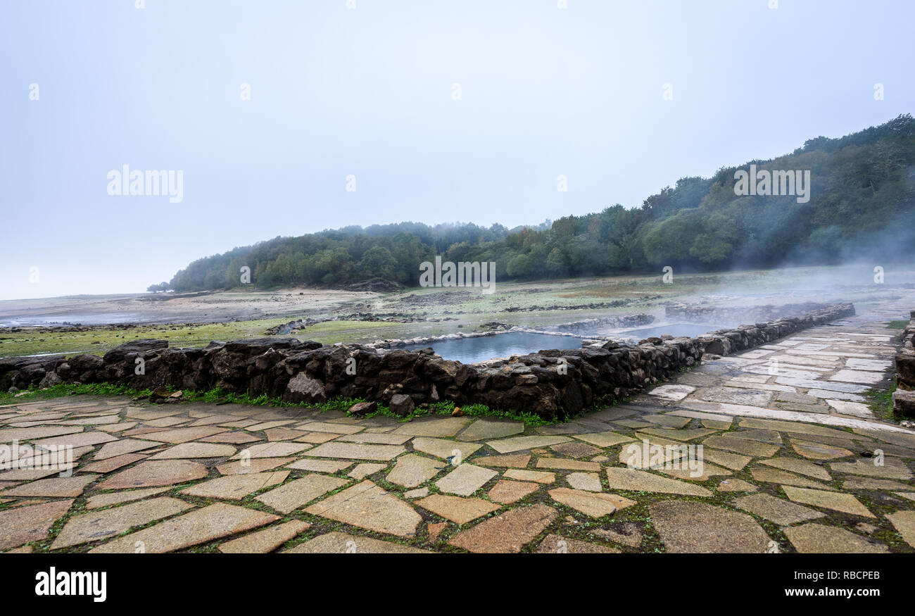 Natural Roman baths outdoors with hot steam and thermal water. Old ...