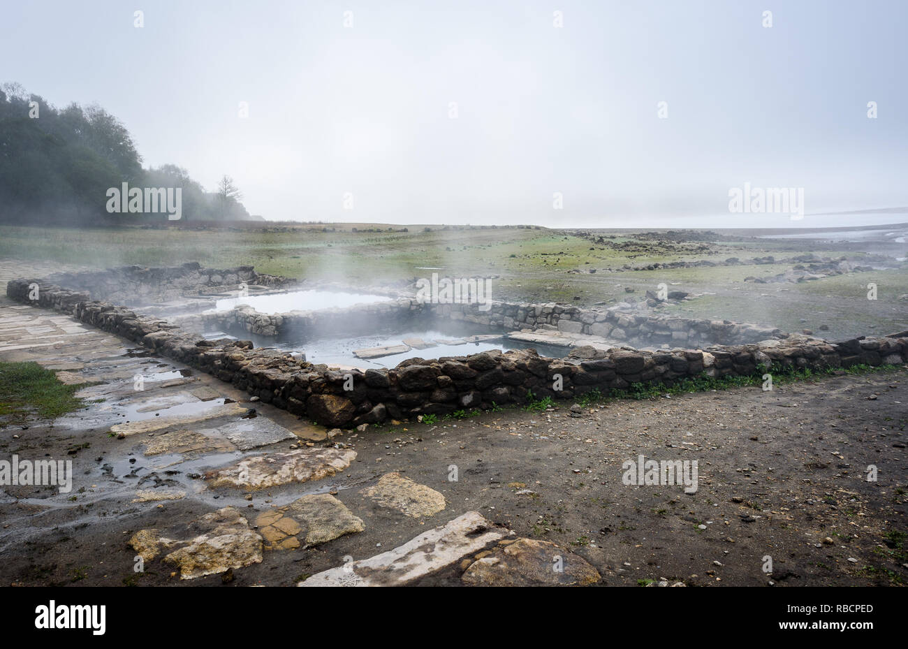 Natural Roman baths outdoors with hot steam and thermal water. Old ...