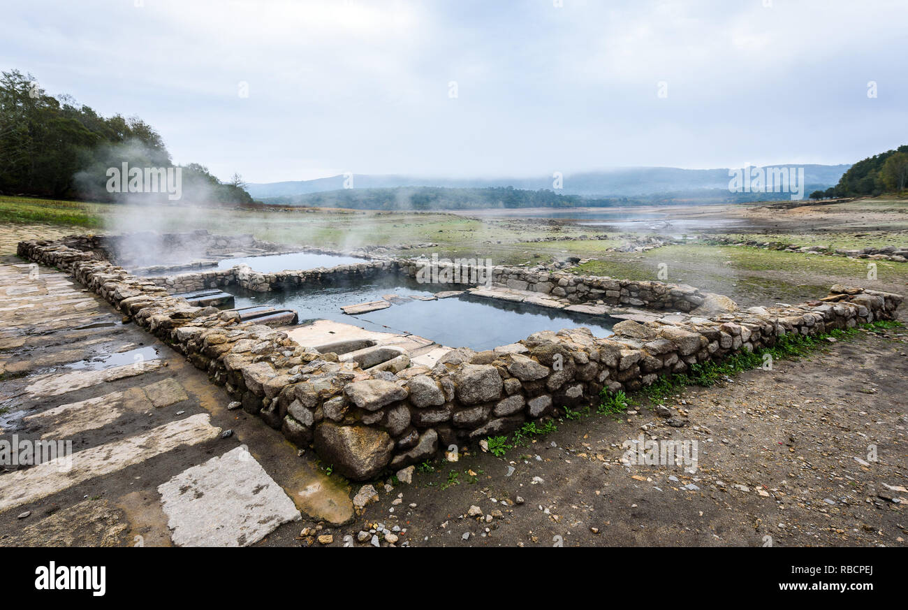 Natural Roman baths outdoors with hot steam and thermal water. Old ...