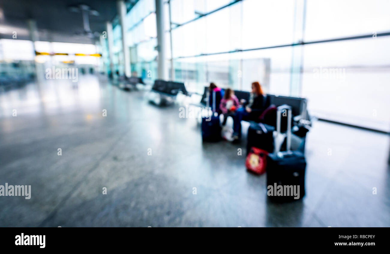 Abstract blurred picture of passengers waiting on the airport. Empty ...
