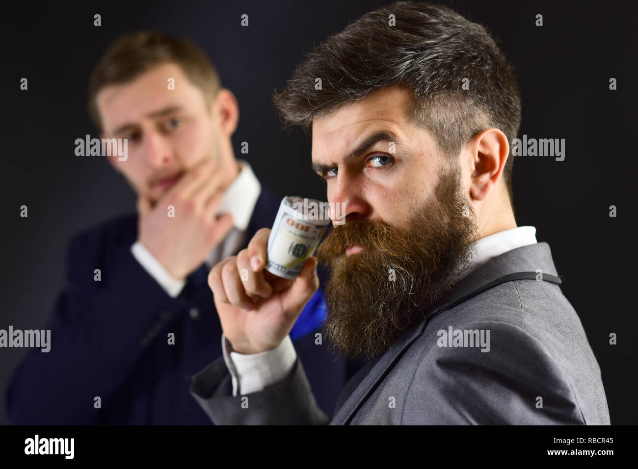 Rich and successful. Busy men. Bearded man with cash money. Successful ...
