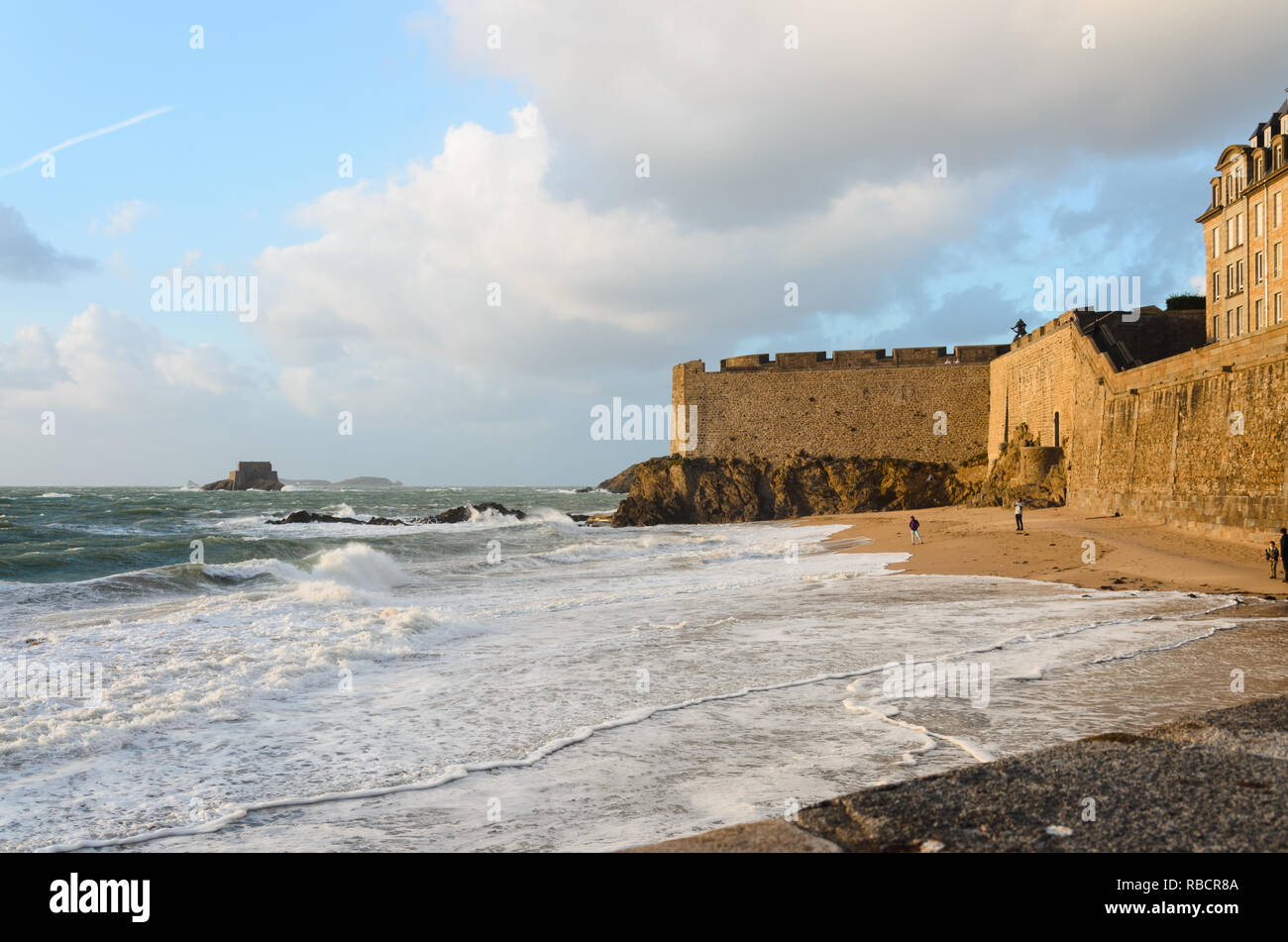 Waves on windy weather in Saint Malo old city walls, with a little ...