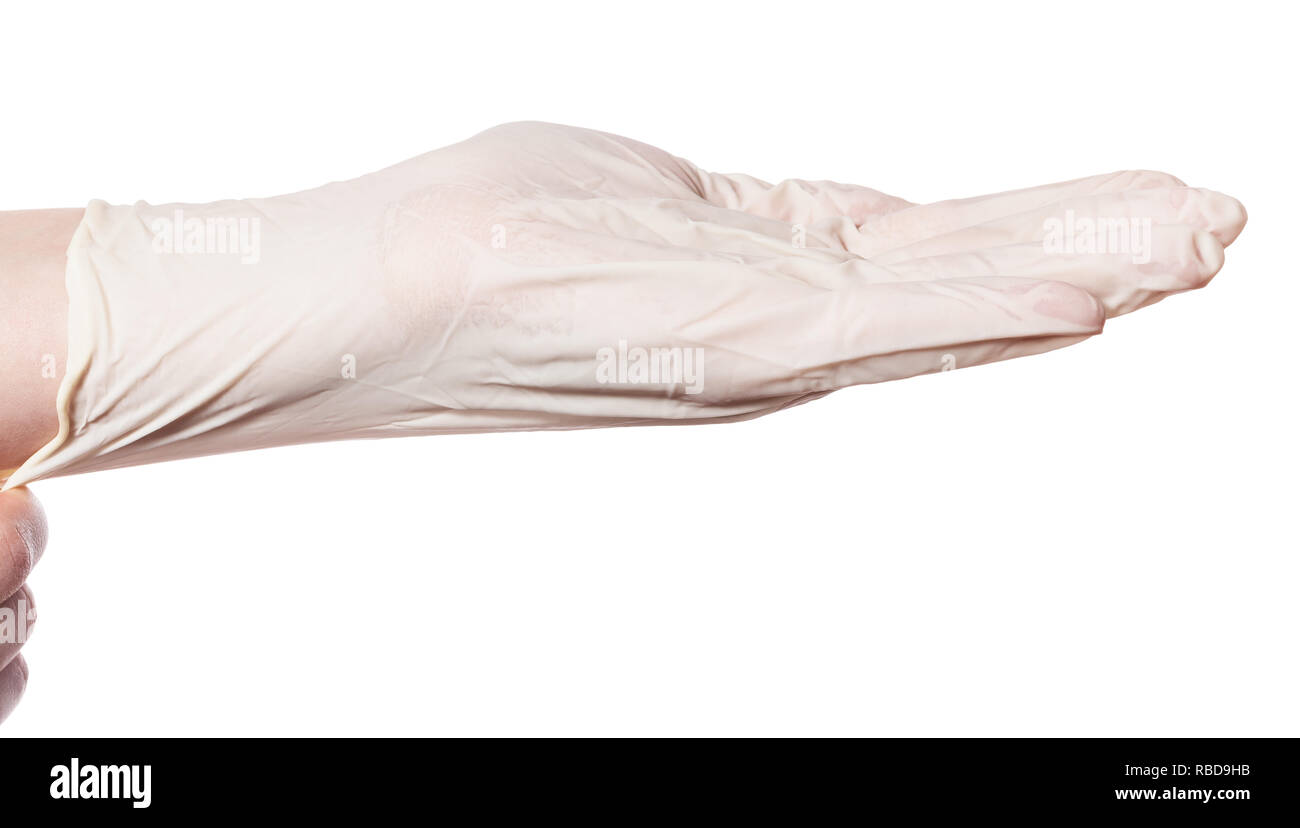 side view of hand pulls latex glove on palm isolated on white ...