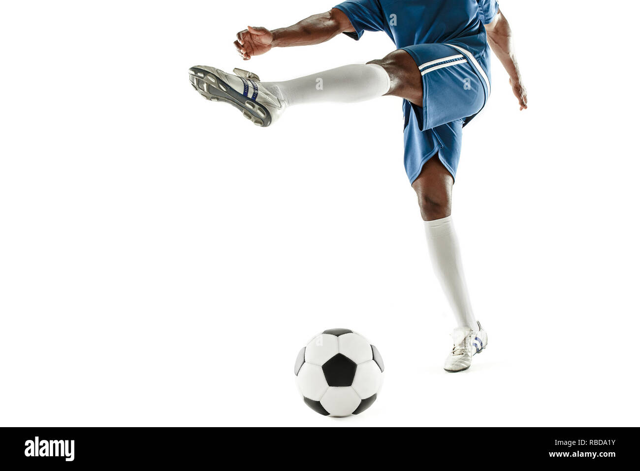 The legs of soccer player close-up isolated on white. African american ...