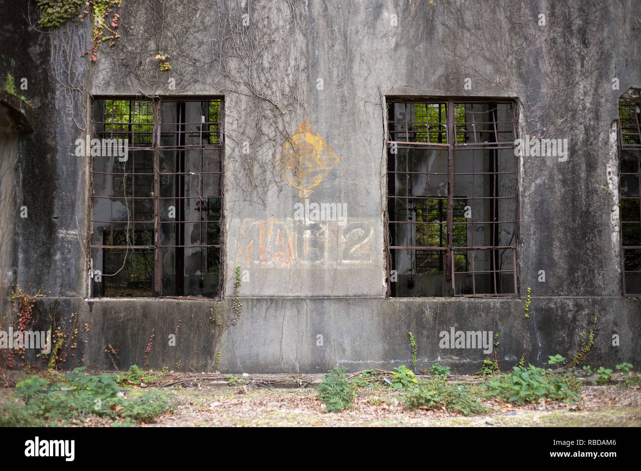 The ruins of the power plant in Okunojima island in Takehara, Hiroshima ...