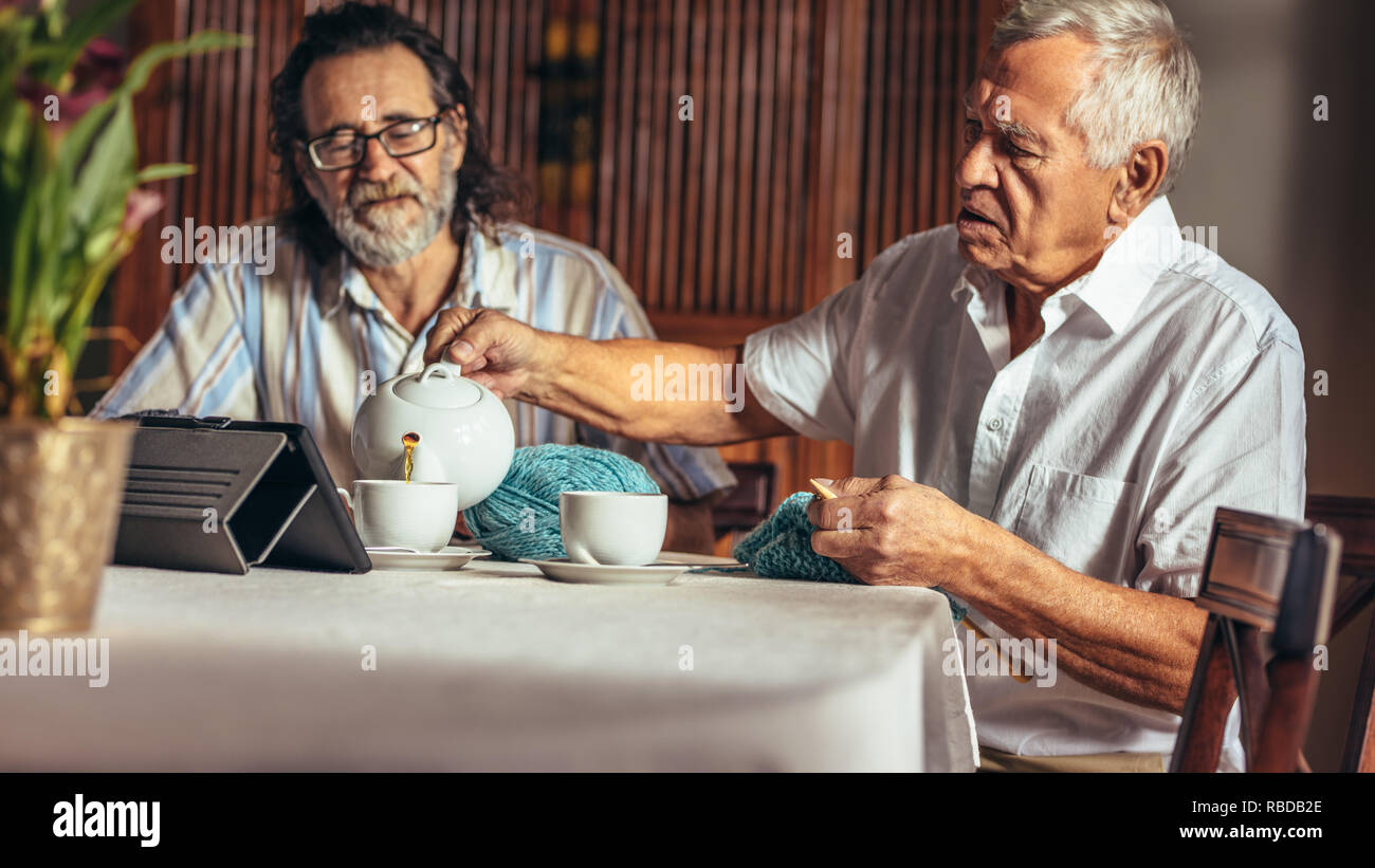 Elderly pouring tea cups hi-res stock photography and images - Alamy