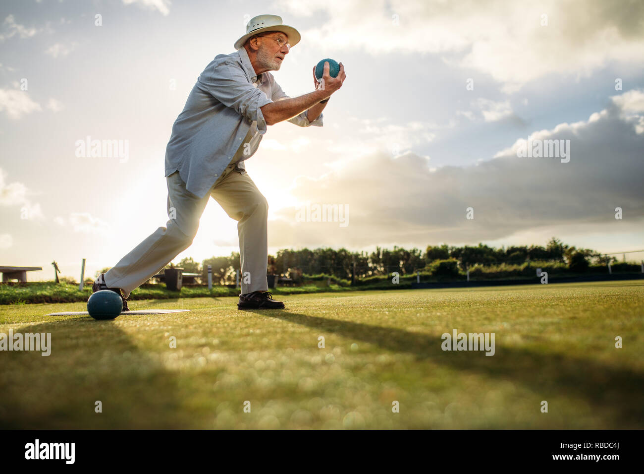 Playing bocce ball in park hi-res stock photography and images - Alamy
