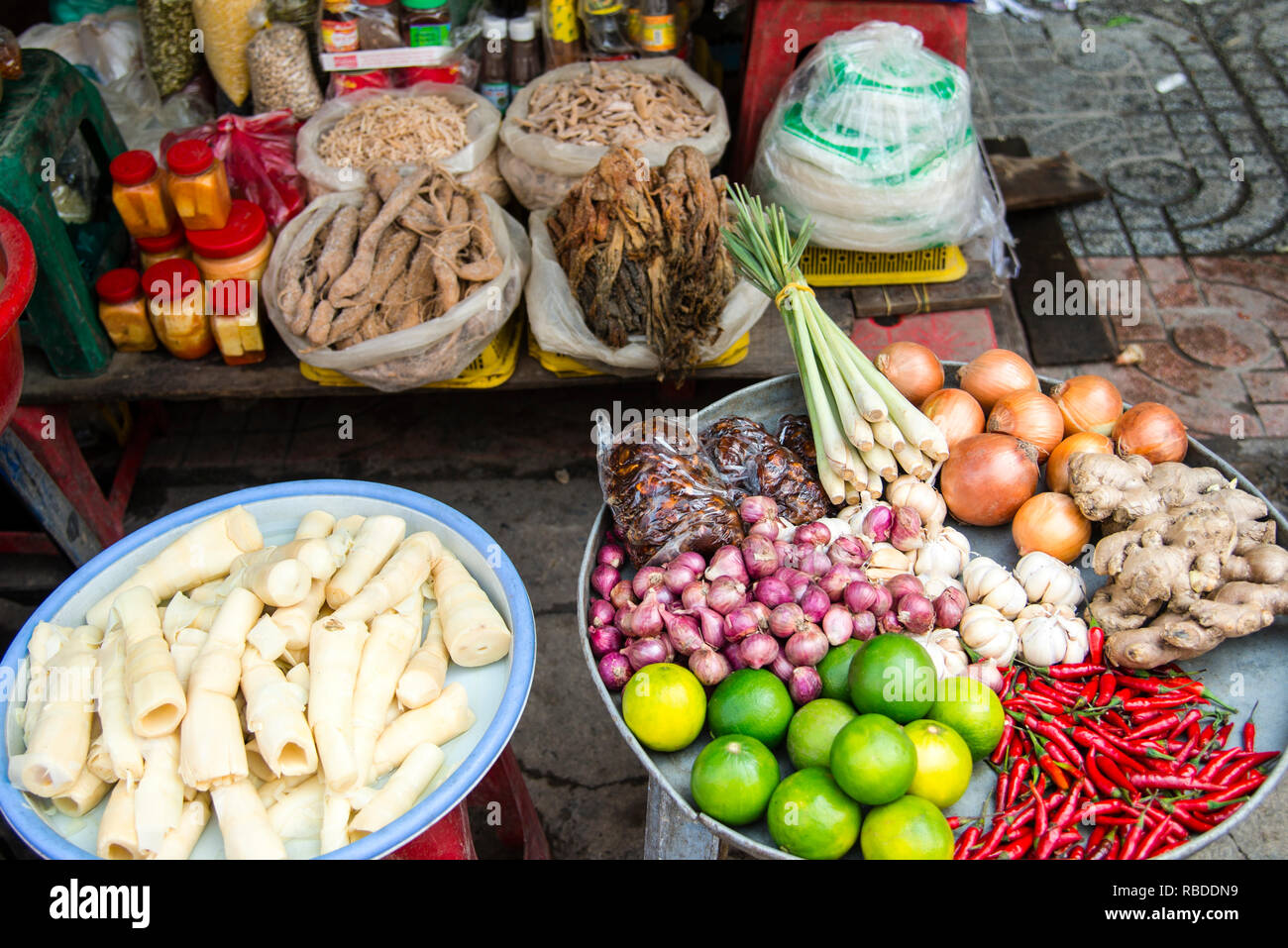 Colorful display of Vietnamese food and spices at a local street market ...
