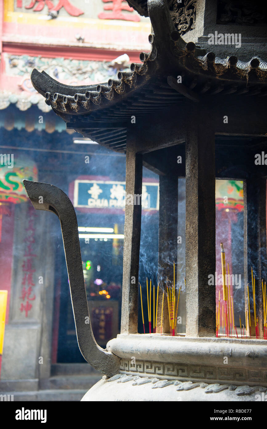 Burning incense at the Ngoc Hoang Pagoda, known as The Jade Emperor ...