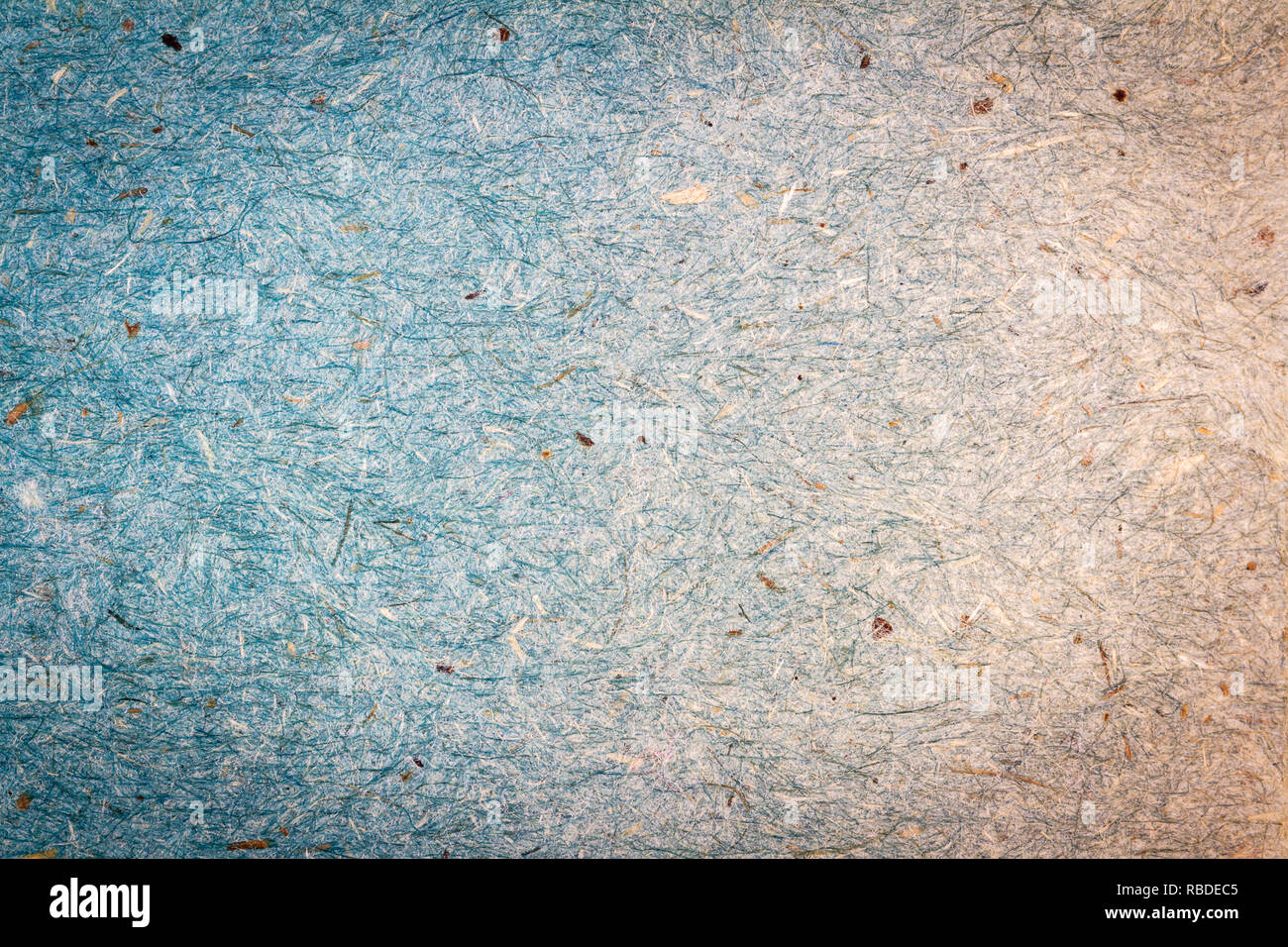 Blue and yellow handmade craft paper texture background. Old rough ...