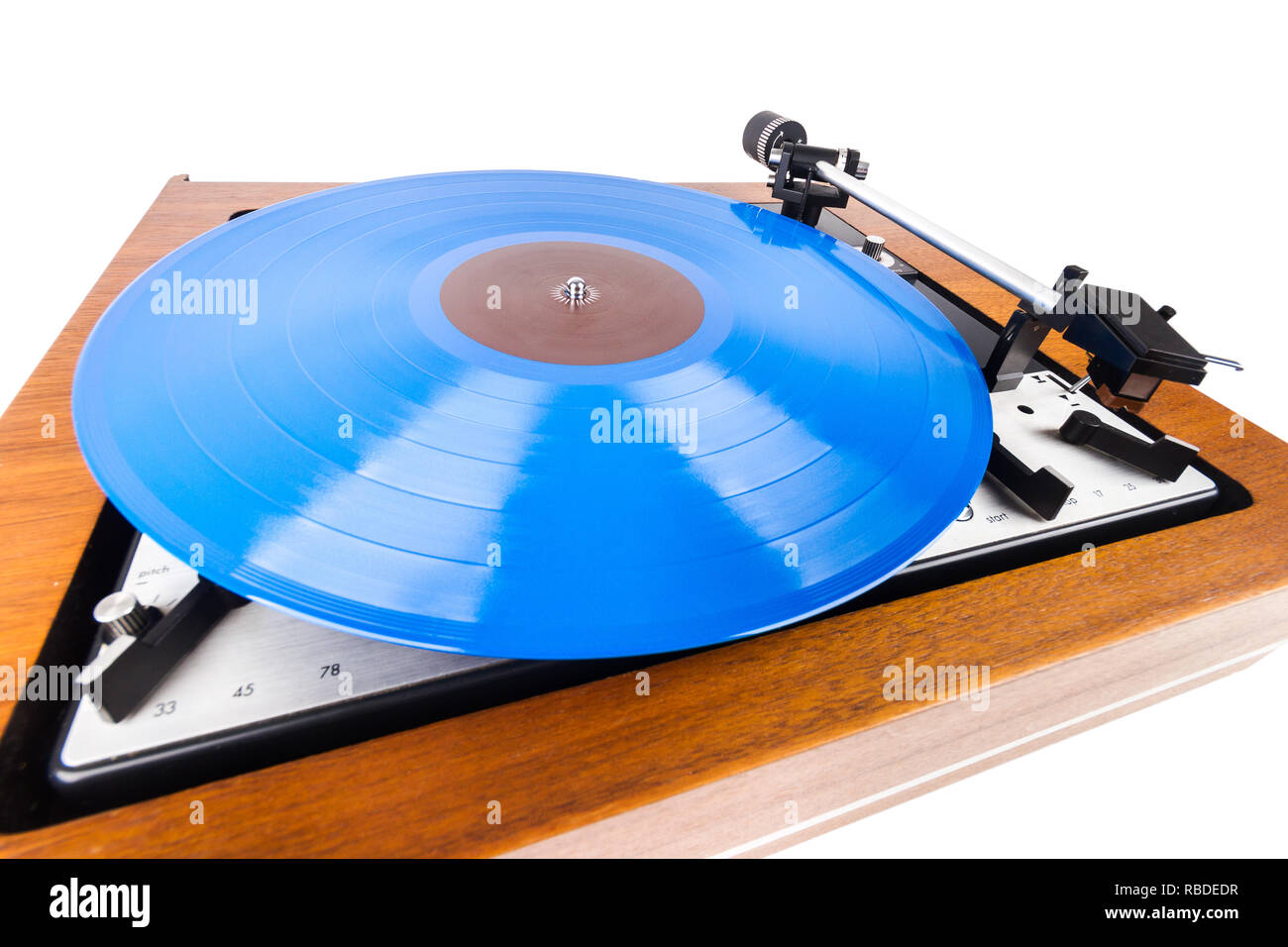 Vintage turntable with a blue vinyl isolated on white. Wooden plinth ...