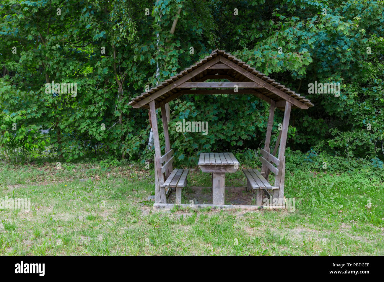 Rest area with seating at the forest Stock Photo - Alamy