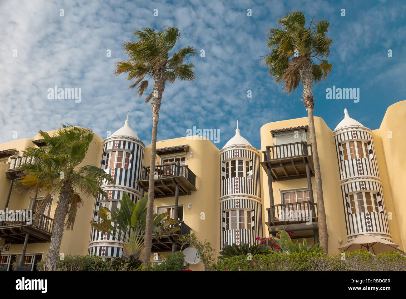 Yellow houses with round towers on the beach Stock Photo - Alamy