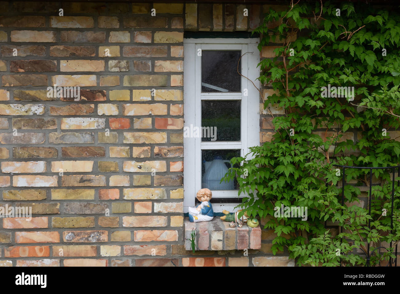 Figures on a window sill Stock Photo - Alamy