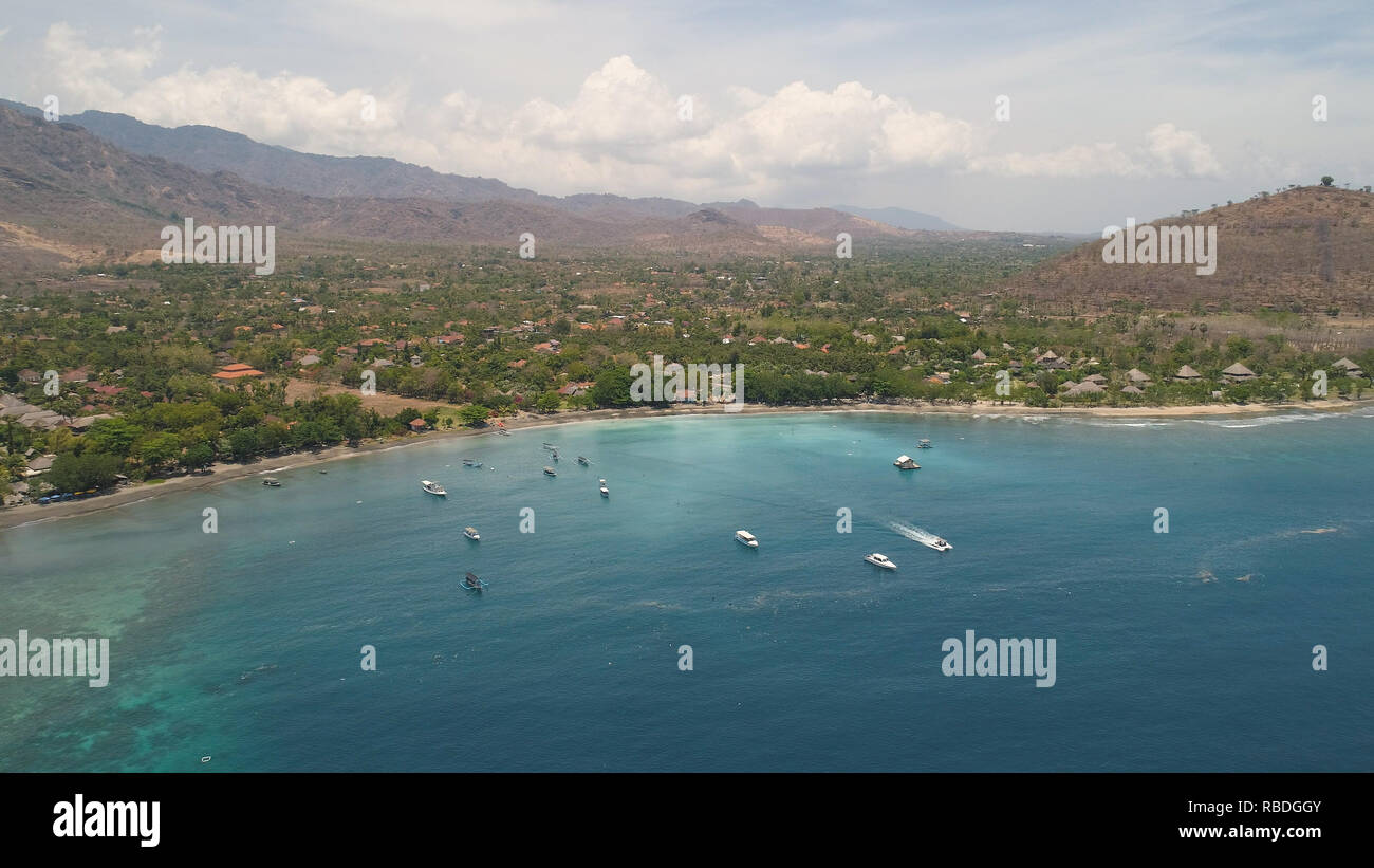 aerial tropical landscape town by sea, mountains, beach, boats on ...