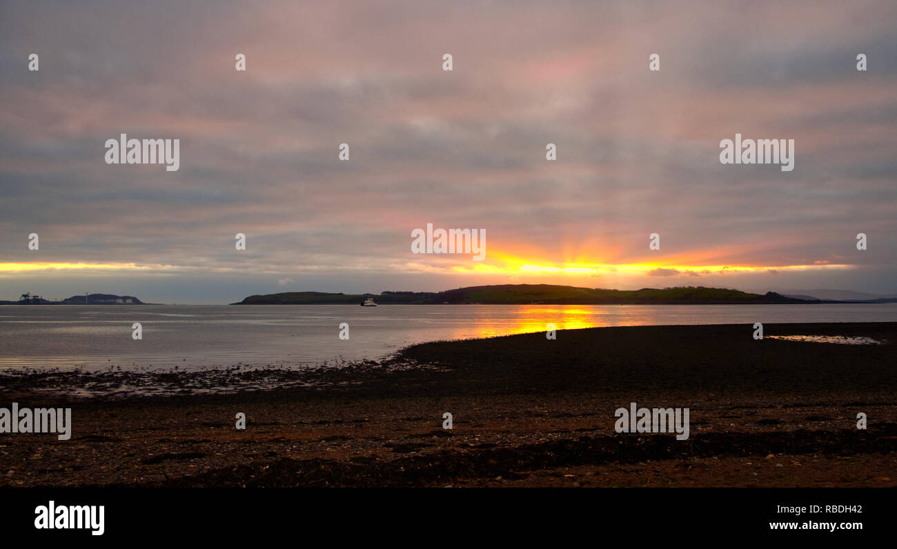 Sunset behind the Isle of Cumbrae on the West Coast of Scotland on the ...