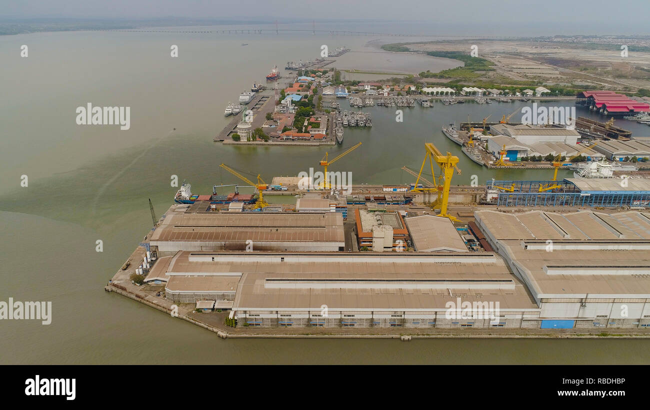aerial view cargo and passenger seaport with ships and crane Tanjung ...
