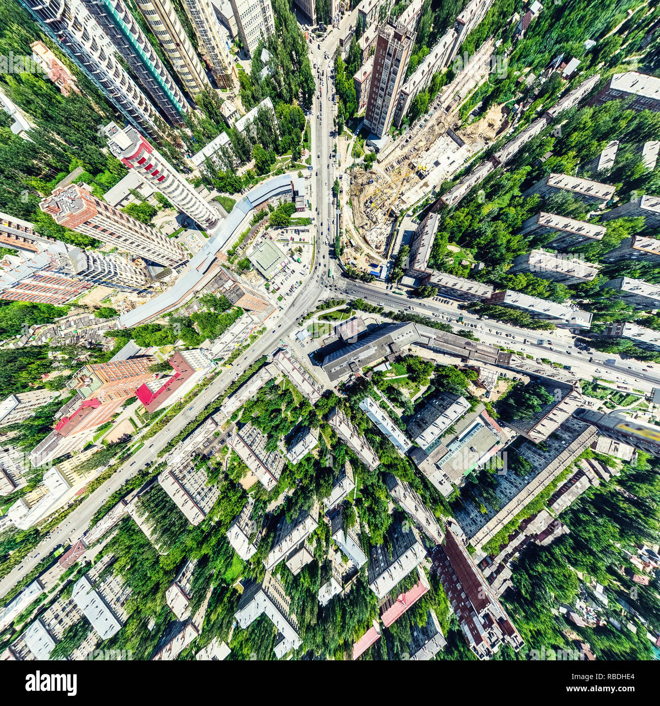 Aerial city view with crossroads and roads, houses, buildings, parks ...