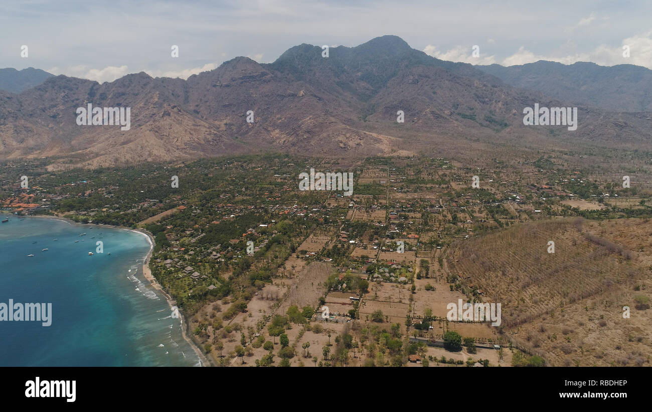 aerial tropical landscape town by sea, mountains, beach, boats on ...