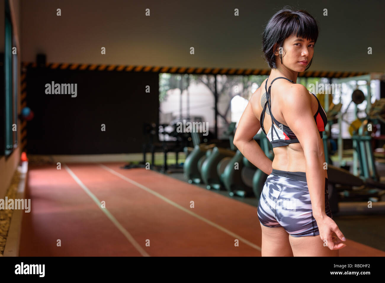 Muscular woman rear view hi-res stock photography and images - Alamy