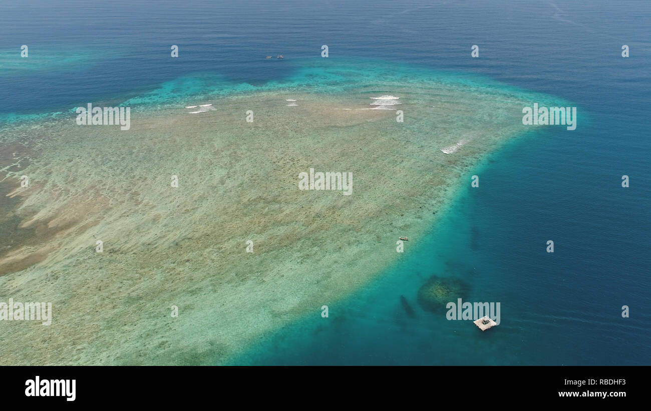 seascape aerial view coral reef, atoll with turquoise water in sea ...