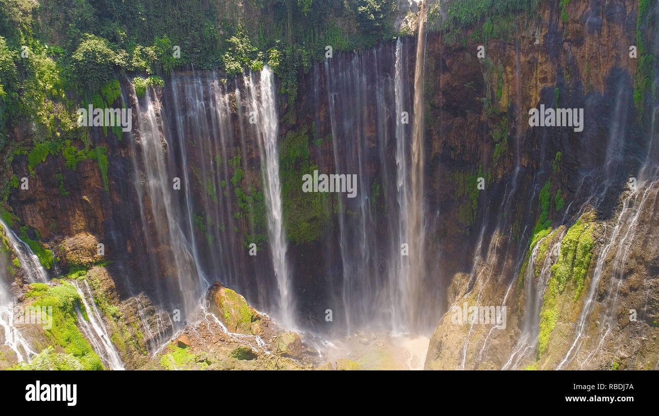 beautiful waterfall Coban Sewu in tropical forest, Java Indonesia ...
