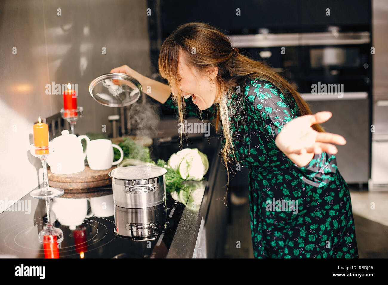 Beautiful lady cooking in kitchen hi-res stock photography and images ...