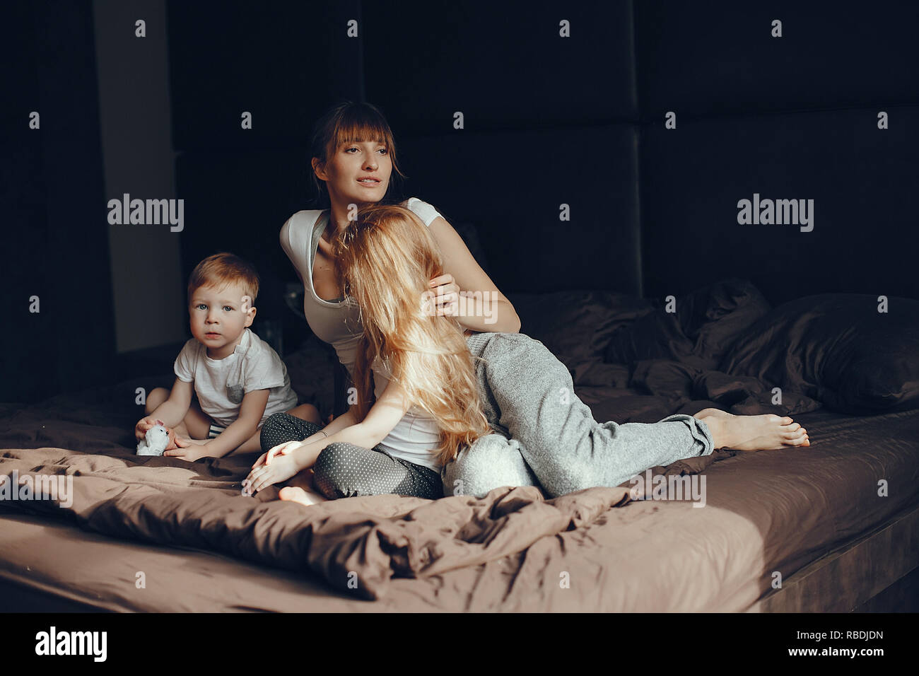 Mother with two childrens Stock Photo - Alamy