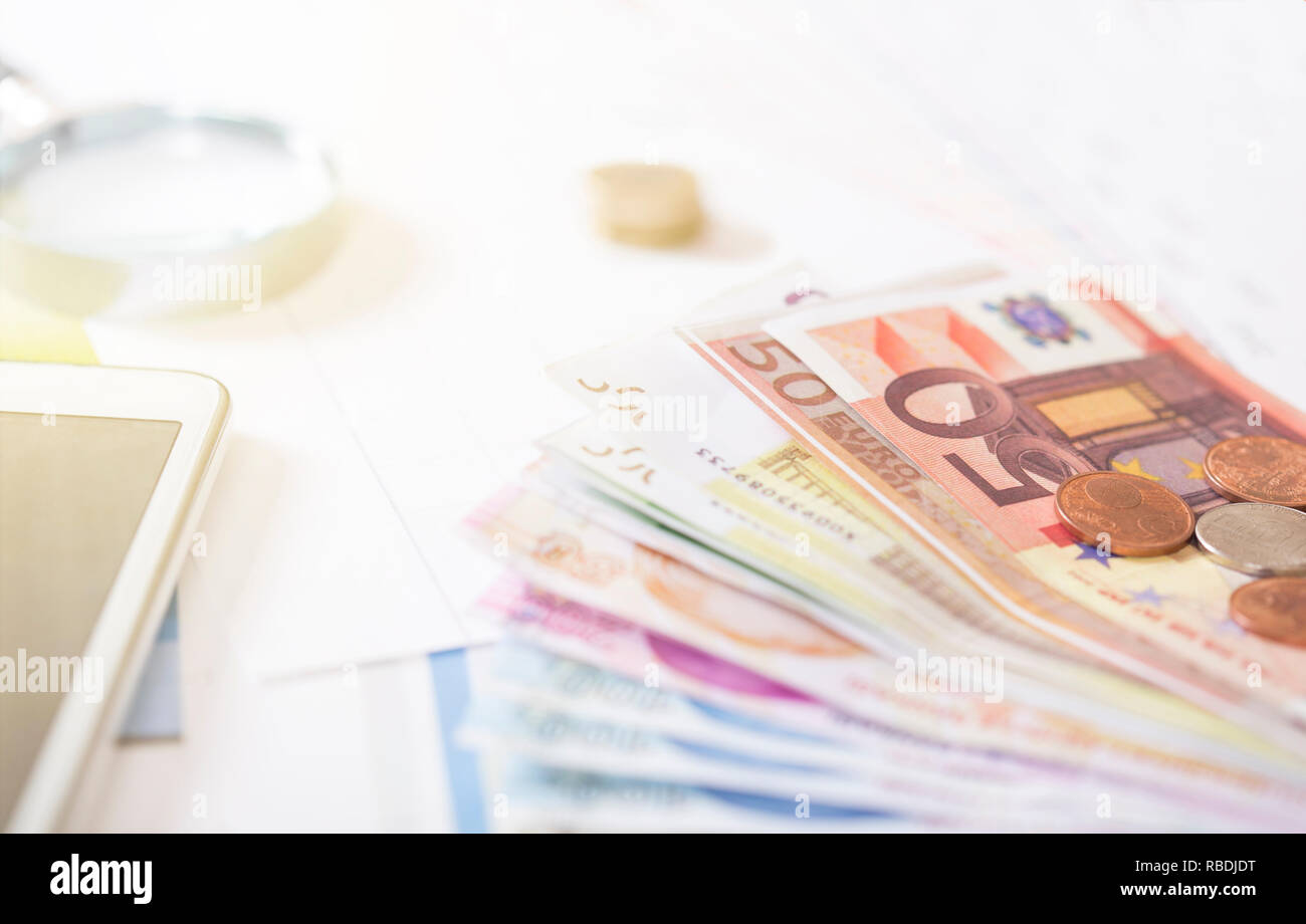 money stack on office desk Stock Photo - Alamy