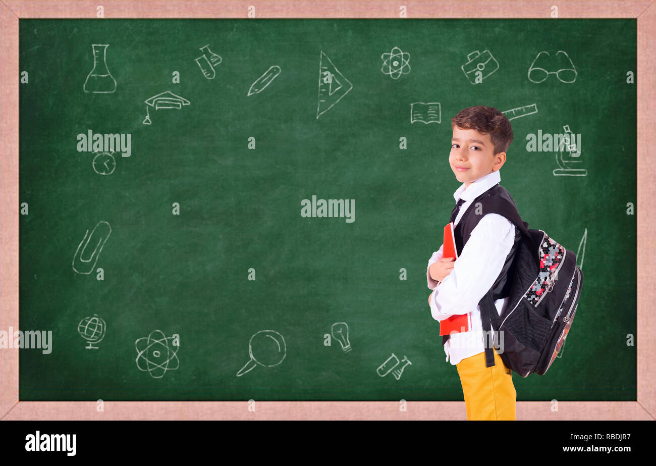 male student standing up front of blackboard Stock Photo - Alamy