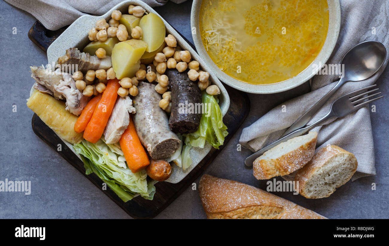 Cocido, traditional chickpea-based stew from Madrid. on the grey stone ...